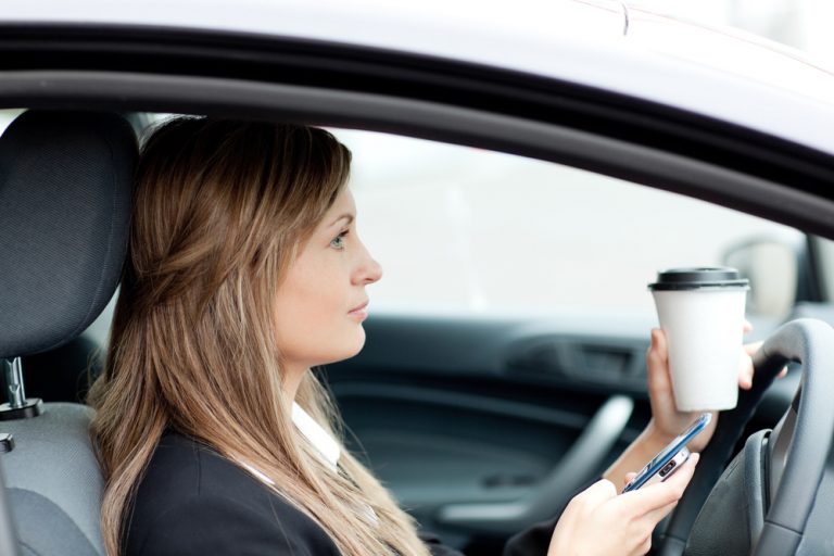 Using Your Mobile Phone While Driving: Laws You Should Know