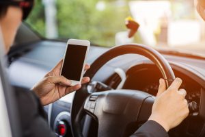 Using Your Mobile Phone While Driving: Laws You Should Know